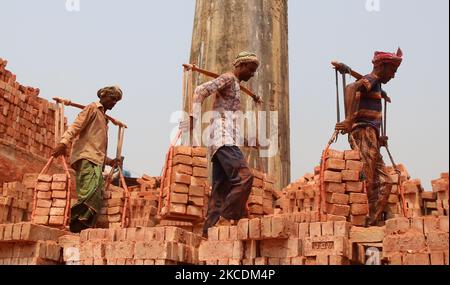 Labourers working at a brickfield on the outskirts of Dhaka, Bangladesh ...