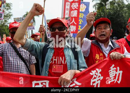 Man with a Pro CCP Tshirt marching with flags, banners, and signs in ...
