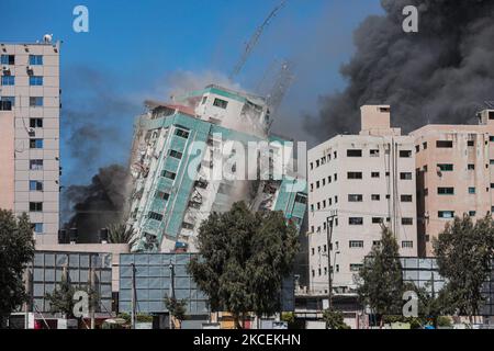 A ball of fire erupts from the Jala Tower as it is destroyed in an ...