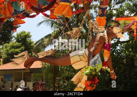 Tamil Hindu devotees perform the para-kavadi ritual while on route to ...