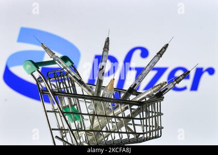 Medical syringes in the mini shopping trolley are seen in front of the ...