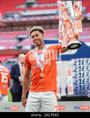 Jordan Gabriel of Blackpool with the winners trophy during the Sky Bet ...