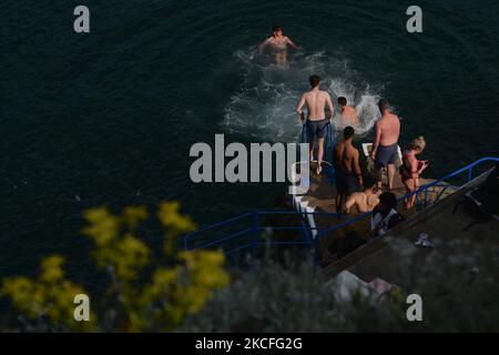 Swimmers at the Vico bathing place, Hawk Cliff, in Dalkey, during Level ...