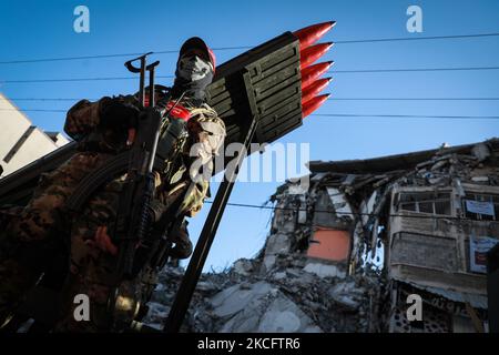 Masked fighters of the National Resistance Brigades, the military wing ...