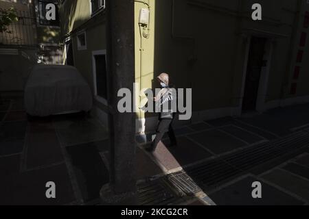 This June 7, 2021, photo a woman uses her phone from Phoenix to Ronald ...