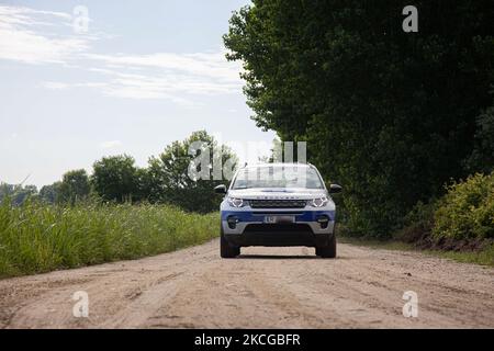 Coast guard land rover oversees air ambulance landing on beach in devon ...