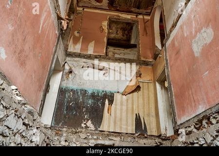 The interior of an abandoned crumbling building. A dying city ...