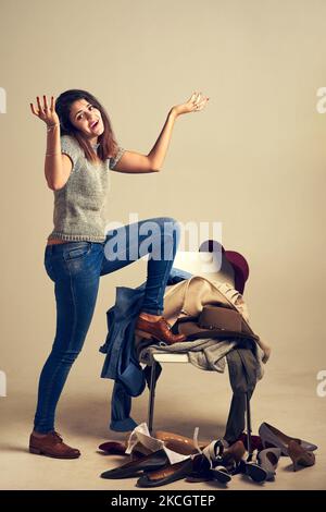 confused lovely woman choosing what to wear Stock Photo - Alamy