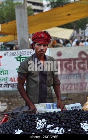 Merchant at the Shaniwaar Subzi Bazaar, which is the largest fruit and ...
