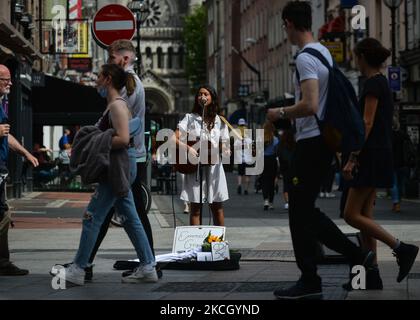Musician and singer Emmeline Gracie performing on Grafton Street in ...