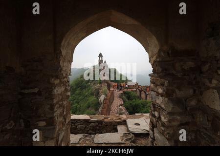 Members of SDRF State Disaster Response Force carry people rescued from ...