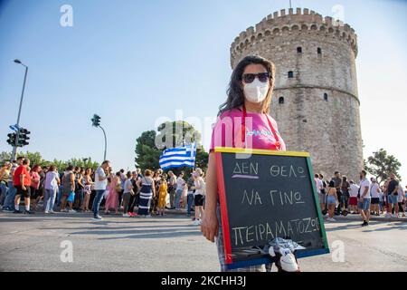 People are seen walking around the lab area of Deciem's Toronto ...