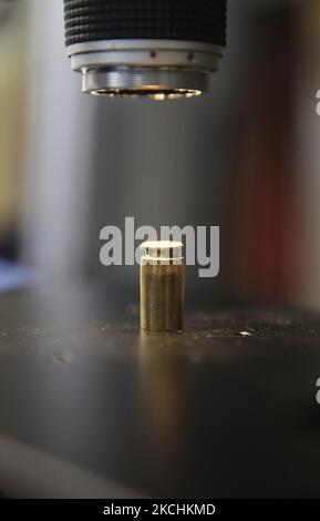 Bullet under a microscope at a college program teaching Crime Scene ...