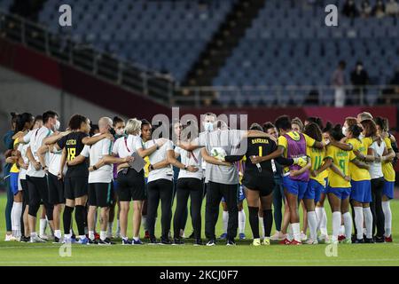 Japan players huddle following the team' 4-0 victory in a World Cup ...