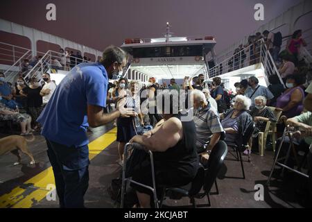 Wildfire approaches the seaside village of Limni, on the island of Evia ...