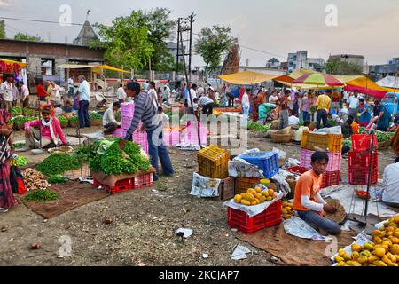 Merchants sell vegetables at the Shaniwaar Subzi Bazaar, which is the ...