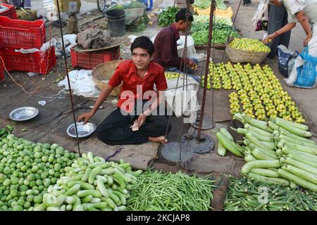 Boy selling vegetables at the Shaniwaar Subzi Bazaar, which is the ...
