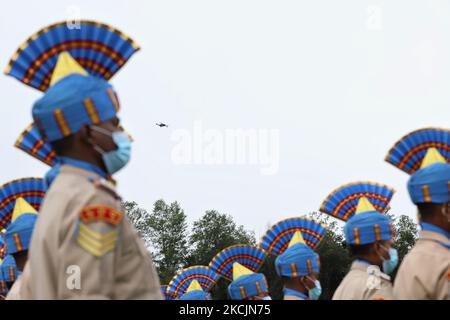 A Contigent of Indian Policemen stand in formation at Khushal Stadium ...