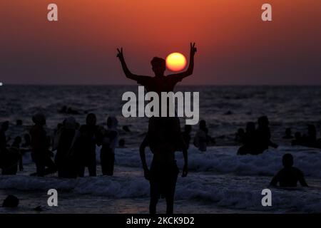 Palestinians enjoy on Gaza Beach during sunset, on November 16, 2020 ...