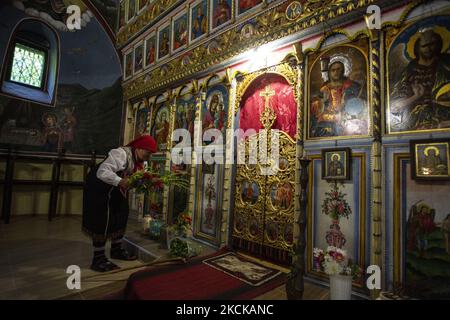 Orthodox priest blessing bread on 28 August 2021 in the church of the ...