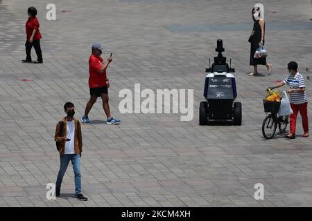 An HTX (Home Team Science and Technology Agency) ground robot, named ...