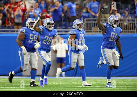 Detroit Lions defensive end Derrick Moore walks to an NFL football ...
