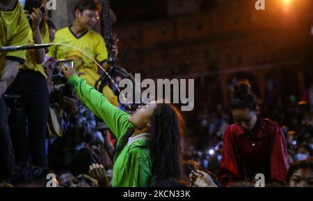 Nepalese women drink homemade alcohol poured from the mouth of Swet ...