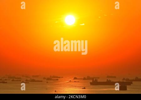 The sun rises as vessels are seen anchored along the southern coast on ...