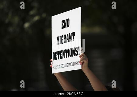 A demonstrator stands in front of the Leland Federal Building in ...