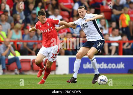 Joe Lolley of Nottingham Forest battles with Richard Keogh of Blackpool ...