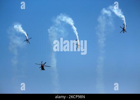 The Indian Air Force's Sarang aerobatic team showcase its manoeuvres at ...