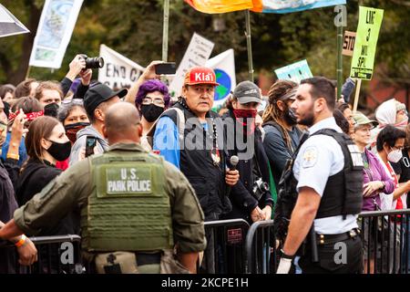 Native American activists and allies await arrest during a protest at ...
