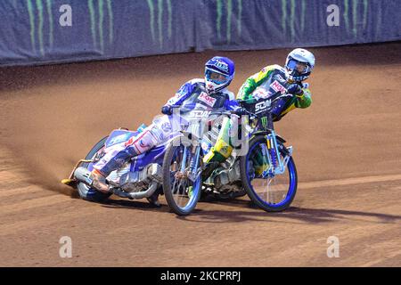 Jason Doyle of Australia (White) locks up behind Dmitri Berge of France ...