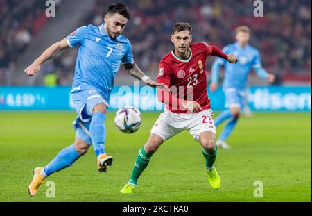 Fabio Tomassini of San Marino competes for the ball with Balint Vécsei ...