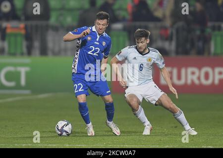Kieran Tierney and Vadim Rata in action during the Fifa World Cup 2022 ...