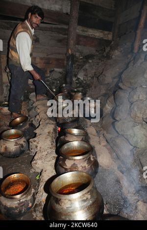 A Waza or cook in the Kashmiri traditions cooks and prepares food for a ...