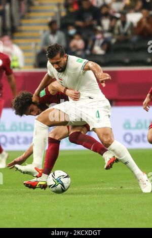 (7) AHMED ALAAELDIN of Qatar team battles for possession (5) HASAN RAED ...