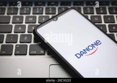 In this photo illustration, the logo of Danone seen displayed on a ...