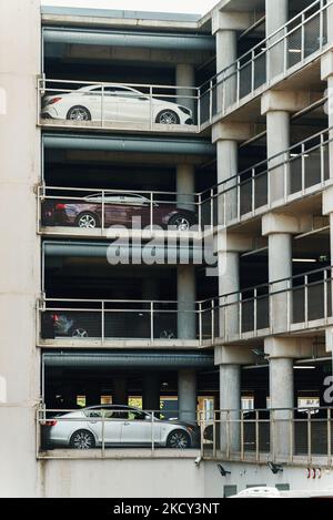 Steel and concrete multi-story parking structure featuring a modern ...