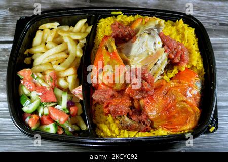 Chicken mandi kabsa with long basmati rice and french fries, served ...