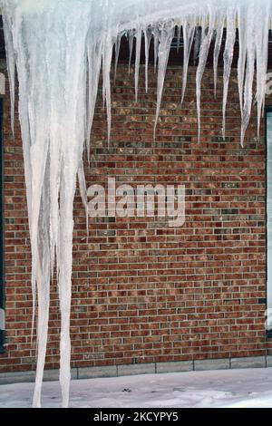 Very large and dangerous icicles close up in winter Stock Photo - Alamy