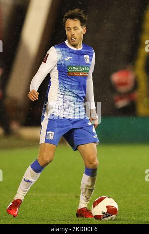 Jamie Devitt of Barrow in action with Kyle Knoyle of Cambridge United ...