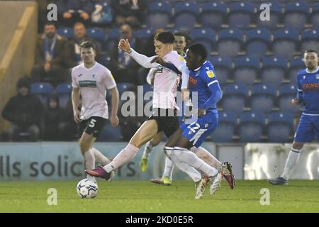 Jacob Wakeling of Barrow battles for possession with Junior Tchamadeu ...
