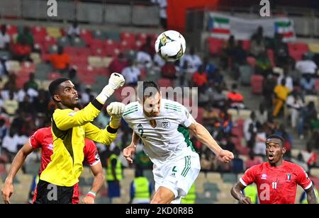 Equatorial Guinea's goalkeeper Jesus Owono, left, tries to stop the ...