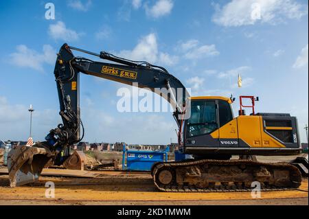 A view of a crane removing the ground placed around the second part of ...