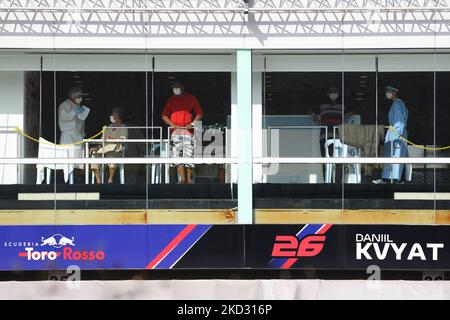 Healthcare workers dressed in personal protective equipment (PPE ...
