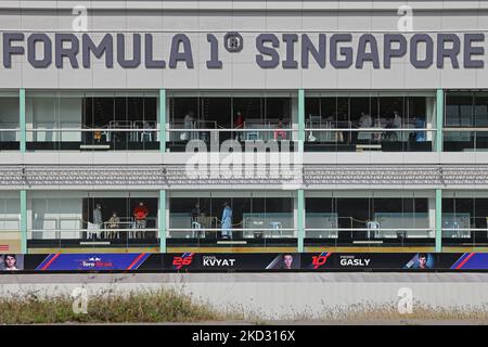 Healthcare workers dressed in personal protective equipment (PPE ...