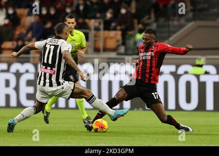 Rafael Leao of AC Milan fights for the ball against Lyanco Vojnovic of ...