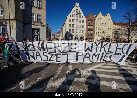 People with Polish flags and nationalist slogans are seen in Gdansk ...