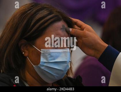 Cardinal Álvaro Ramazzini makes the sign of the cross with ashes on the ...